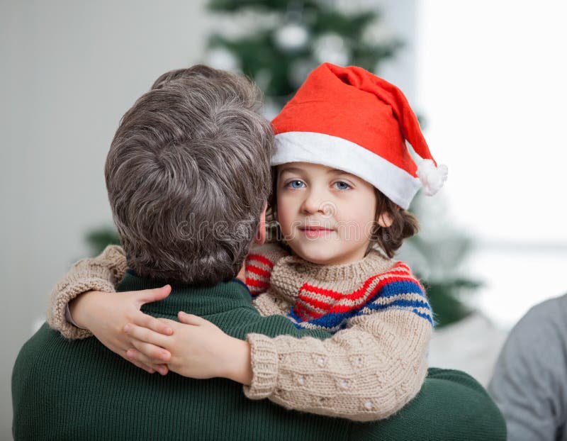 Son Embracing Father during Christmas Stock Photo - Image of evening ...