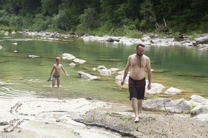 A Son and a Father at the River Stock Image - Image of happiness, green ...