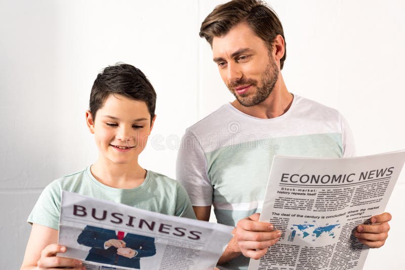 Father Reading Newspaper and Offended Son Stock Photo - Image of plate ...