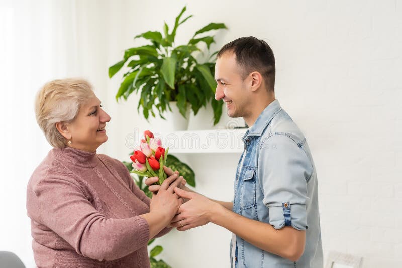 Son Giving Mother Flowers Tulips Stock Image - Image of relative, love ...