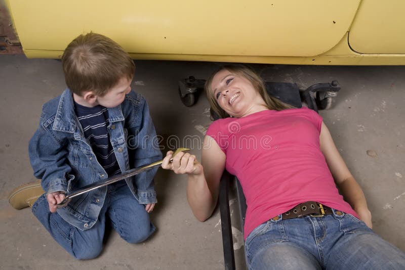 Son handing mom tool stock image. Image of power, lifestyle - 14076029