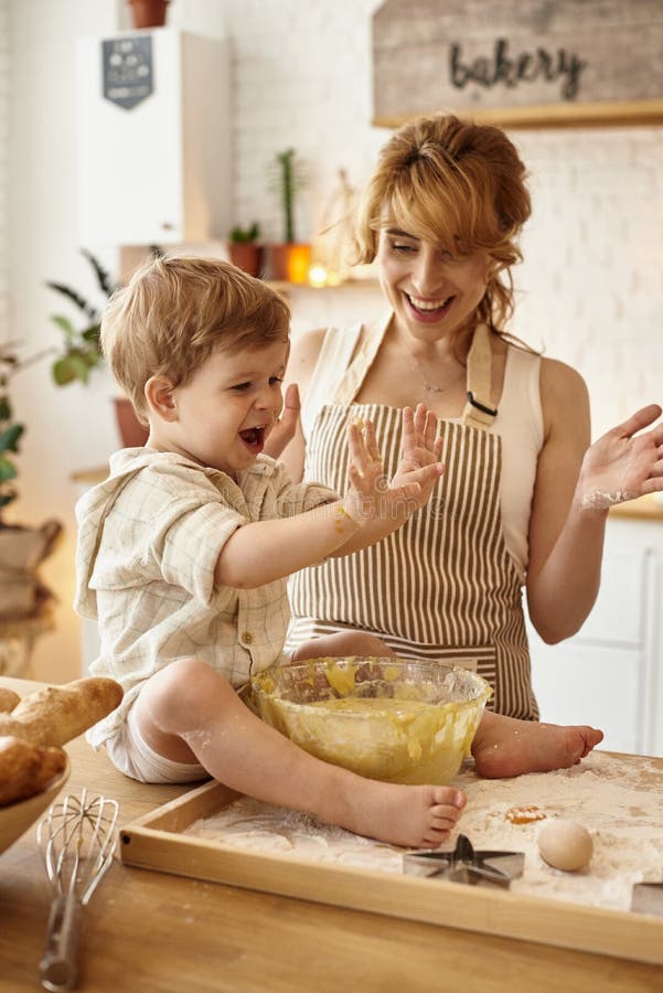 Son Helps Mom in the Kitchen Stock Photo - Image of little, family ...