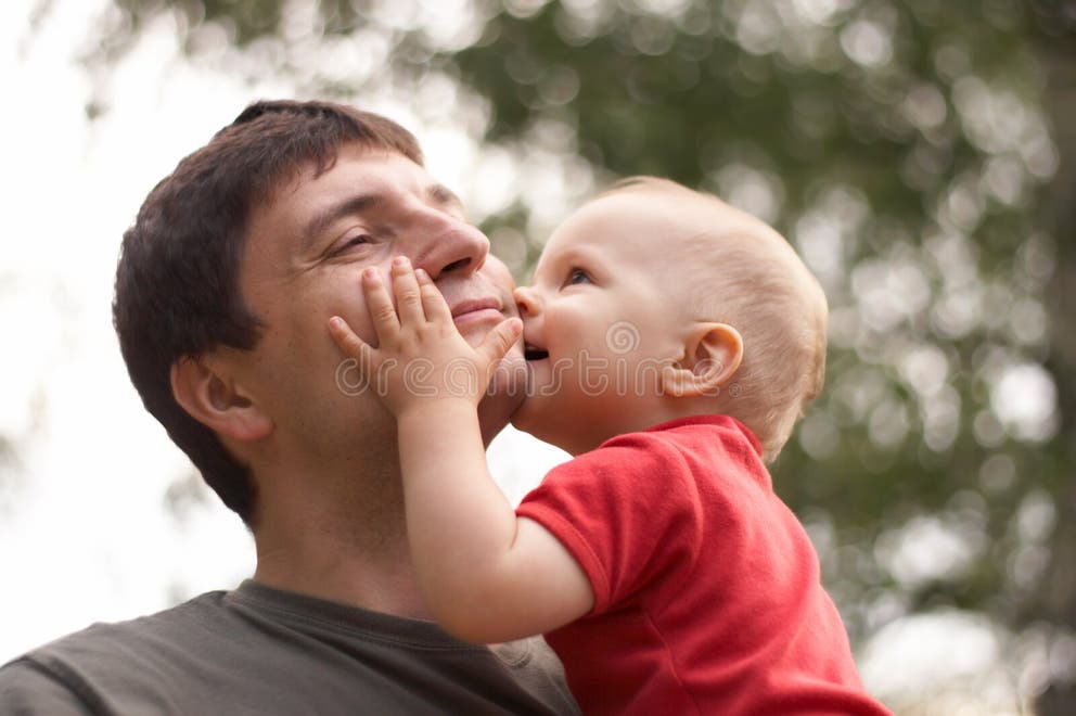 Son kissing his father stock photo. Image of childhood - 6482938