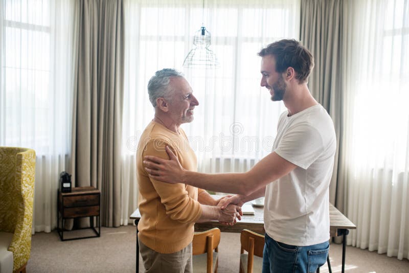 Son Visitng His Dad, Both Looking Happy Stock Image - Image of indoors ...