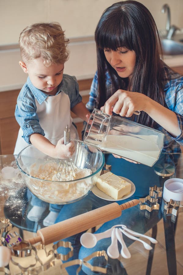 Son Whisking Dough and Mother Stock Photo - Image of food, parenting ...