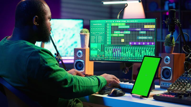 Songwriter Composer Mixing and Mastering Tracks Next To Green Screen ... Songwriter Composer Mixing and Mastering Tracks Next To Green Screen ...