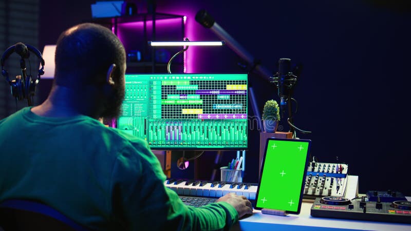 Songwriter Composer Mixing and Mastering Tracks Next To Green Screen ... Songwriter Composer Mixing and Mastering Tracks Next To Green Screen ...