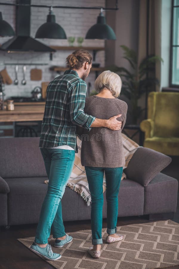 Young Man in Jeans Supporting His Mom Stock Photo - Image of sick ...