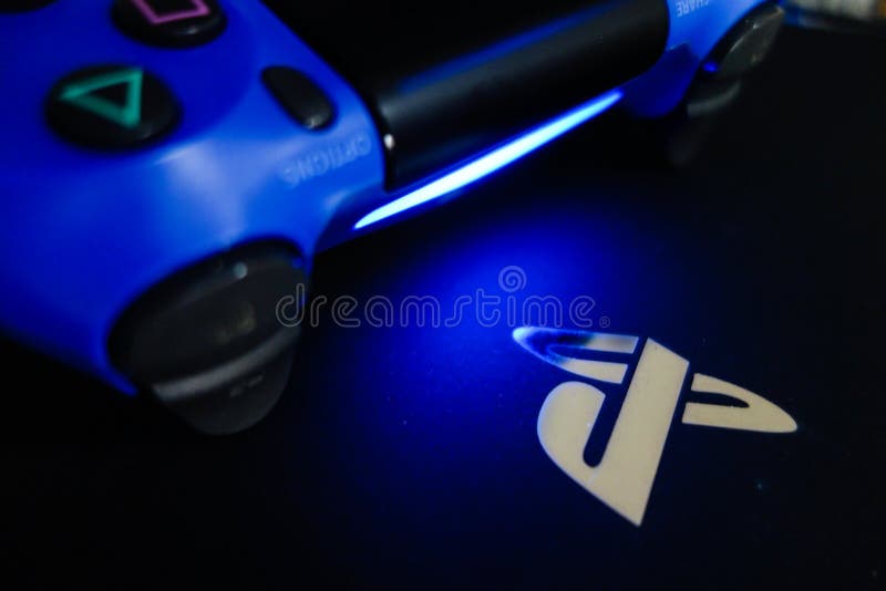 Sony Playstation Logo Illuminated on Blue Light from Game Controller ...