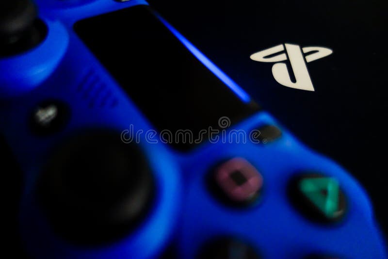 Sony Playstation Logo Illuminated on Blue Light from Game Controller ...