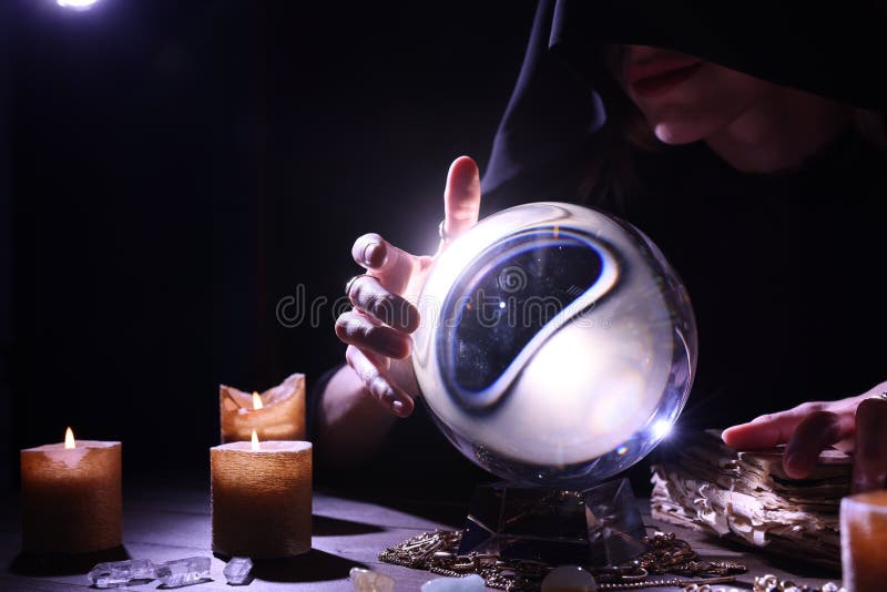 Soothsayer Using Crystal Ball To Predict Future at Table in Darkness ...