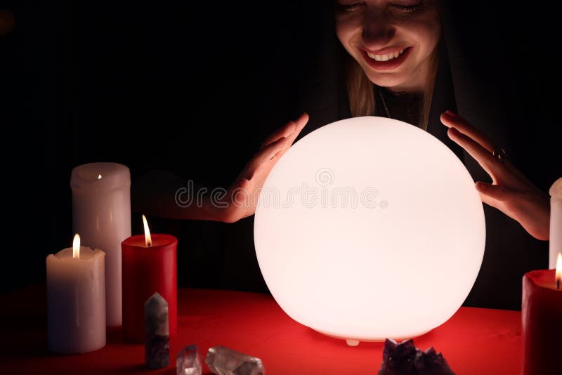 Soothsayer Using Glowing Crystal Ball To Predict Future at Table in ...