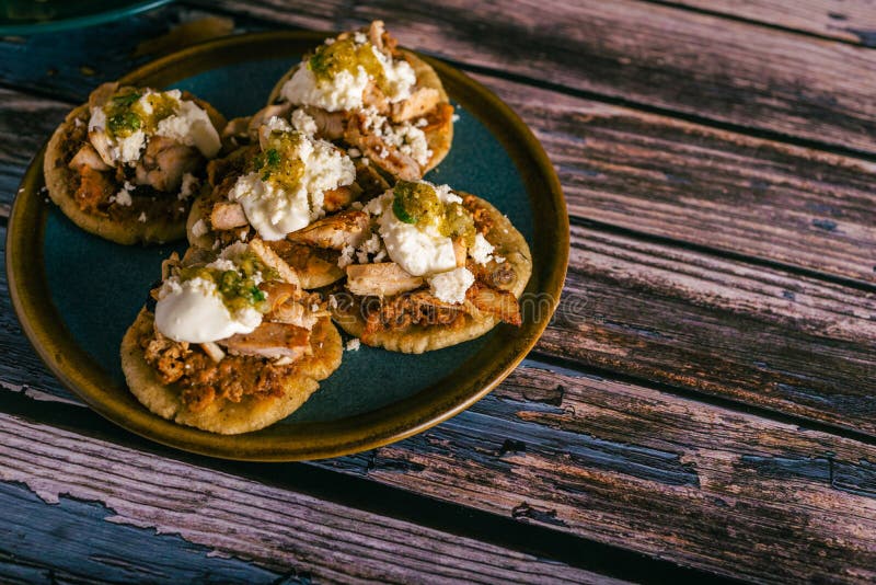 Sopitos, Typical Mexican Dish on Wooden Table. Sopes Stock Image ...