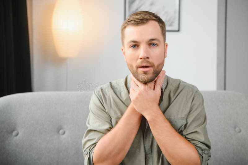 Sore Throat. Dark-haired Young Man Having a Sore Throat. Stock Photo ...