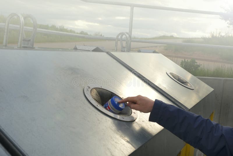 Sorted Garbage. Metal Trash. Hand Throws an Empty Container into a ...