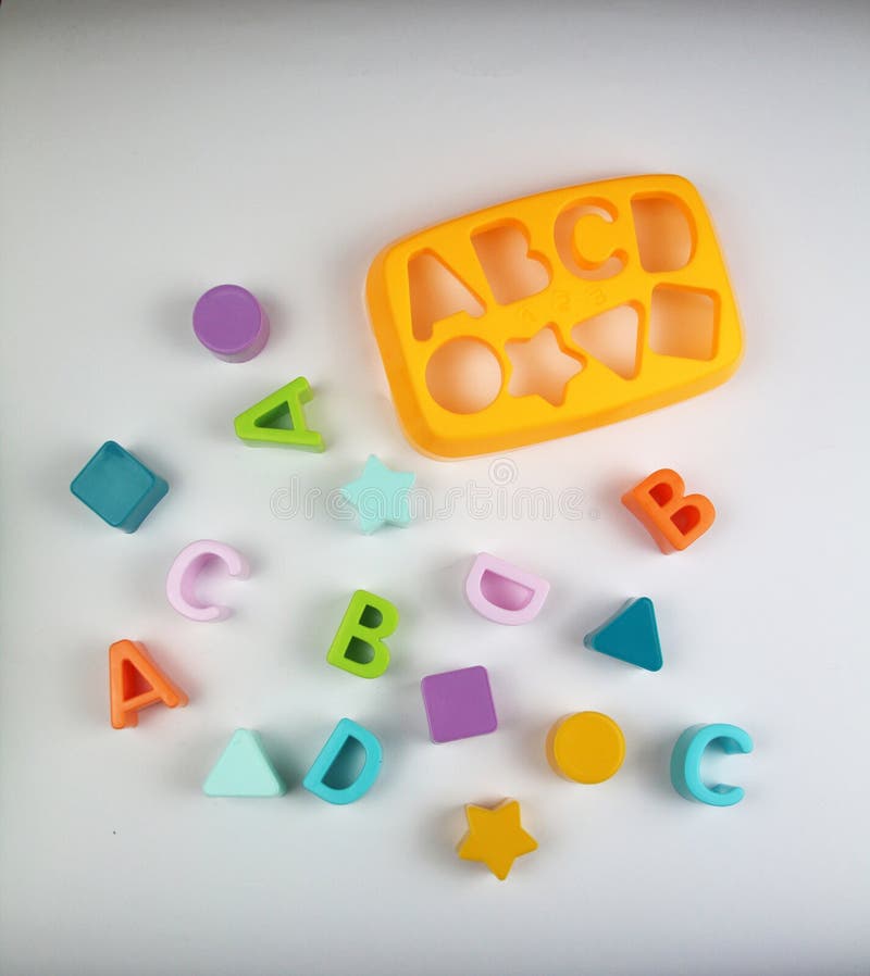 Sorter Game with Letters and Figures. Concept of Training. Stock Photo ...