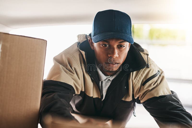 Sorting through All the Boxes. a Courier Sorting Boxes in a Delivery ...