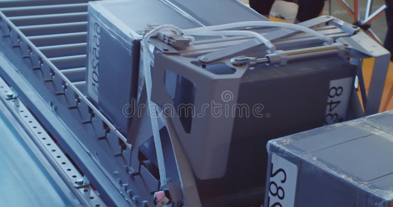 Sorting of Cargo. Boxes Move on a Conveyor Inside the Warehouse. Modern ...