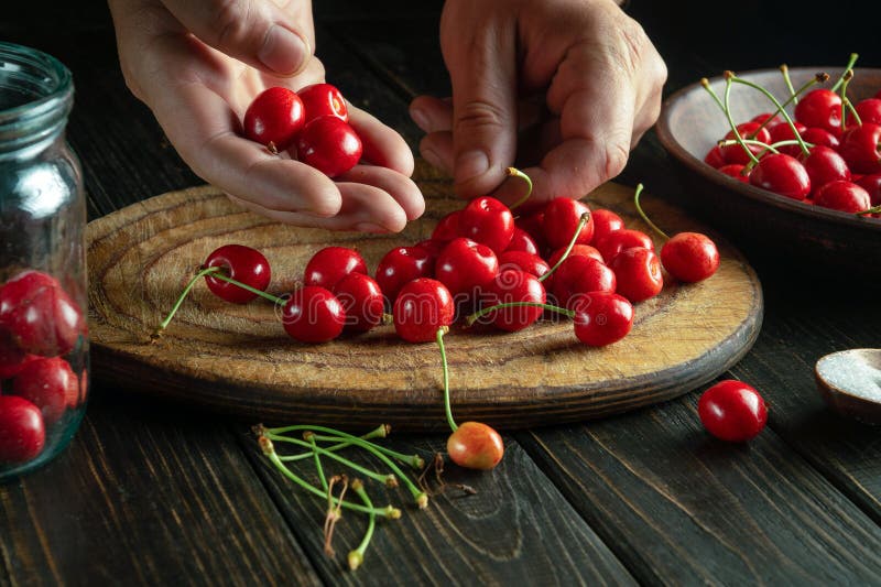 Sorting Cherries by the Hands of the Cook. Preparing Sweet Jam from ...
