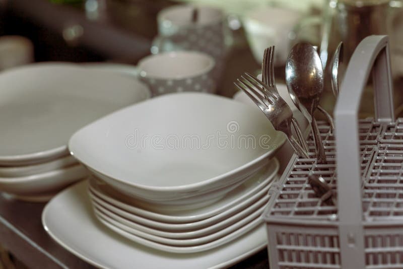 Sorting clean dishes stock photo. Image of sorting, washer - 240063312