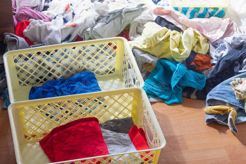 Sorting Clean Laundry by Clothing Storage Containers. Stock Photo ...