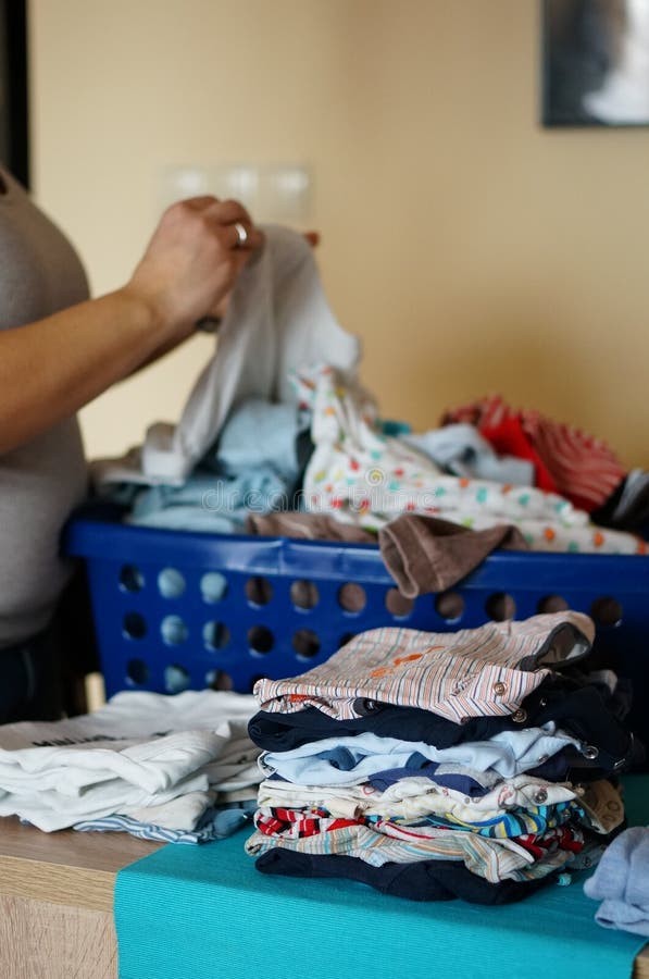 Clothes Sorting In Wardrobe On White Shelf Background. To Wear Now, If ...