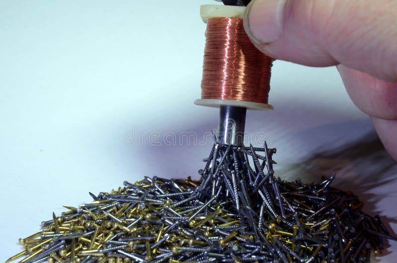 Sorting iron from brass stock image. Image of school - 104549351