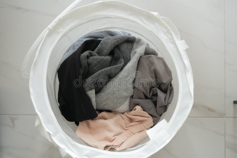 Sorting Laundry in a Round Basket at Home on a Bright Day Stock Photo ...
