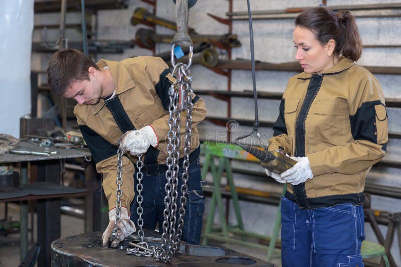 Sorting out the chains stock image. Image of worker - 150197783