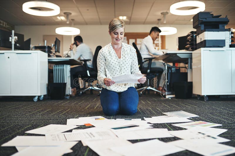 Sorting Out Her Paperwork. a Businesswoman Working with Paperwork on ...
