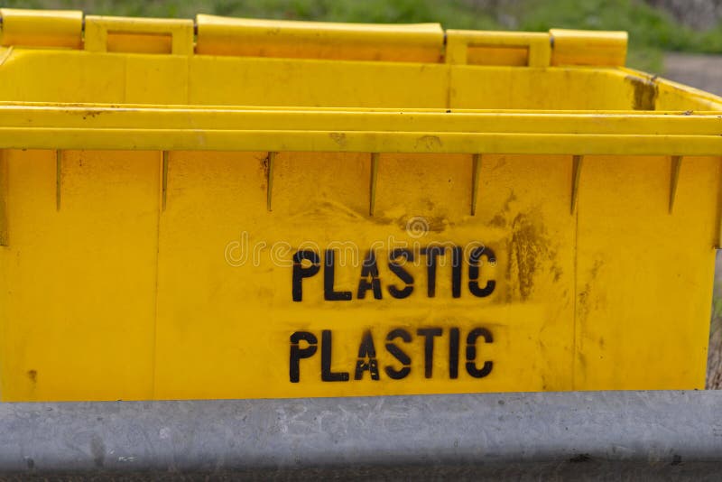 Yellow plastic trash bin stock image. Image of bottle - 62619675