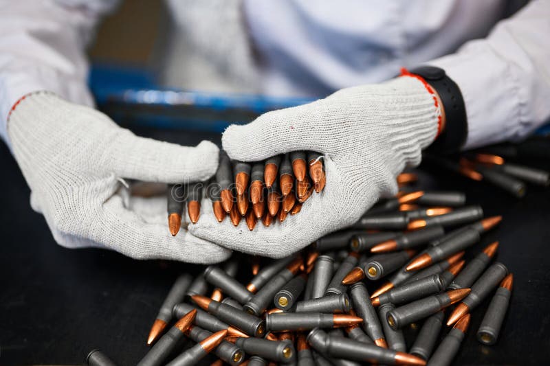 Sorting and Selective Quality Control of Weapon Cartridges. Hands of ...