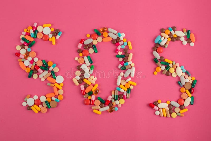 SOS Arranged from Assorted Pharmaceutical Medicine Pills, Tablets and ...