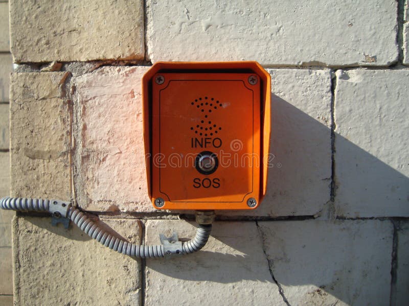 SOS button on the wall stock photo. Image of sign, yellow - 221284614
