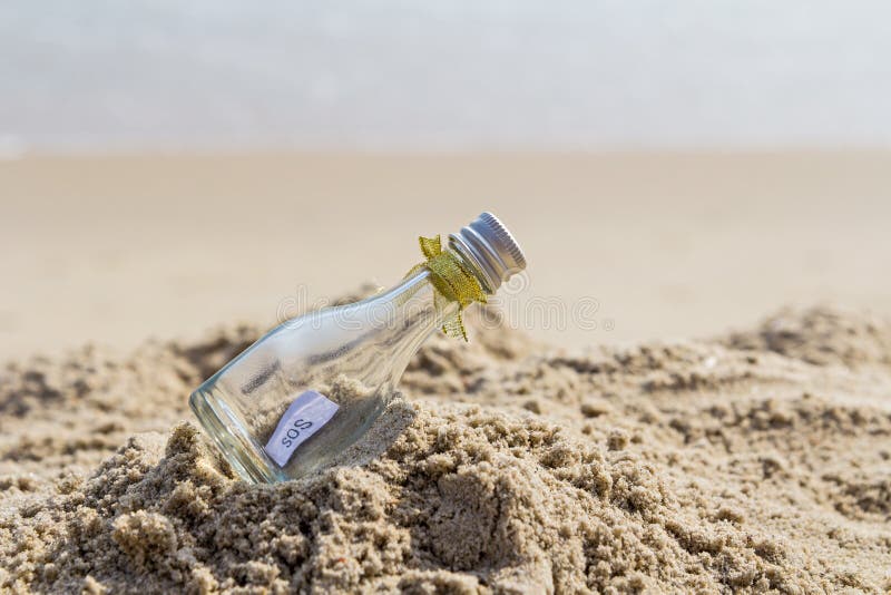 SOS Message in Bottle on the Beach. Stock Photo - Image of idea, beach ...