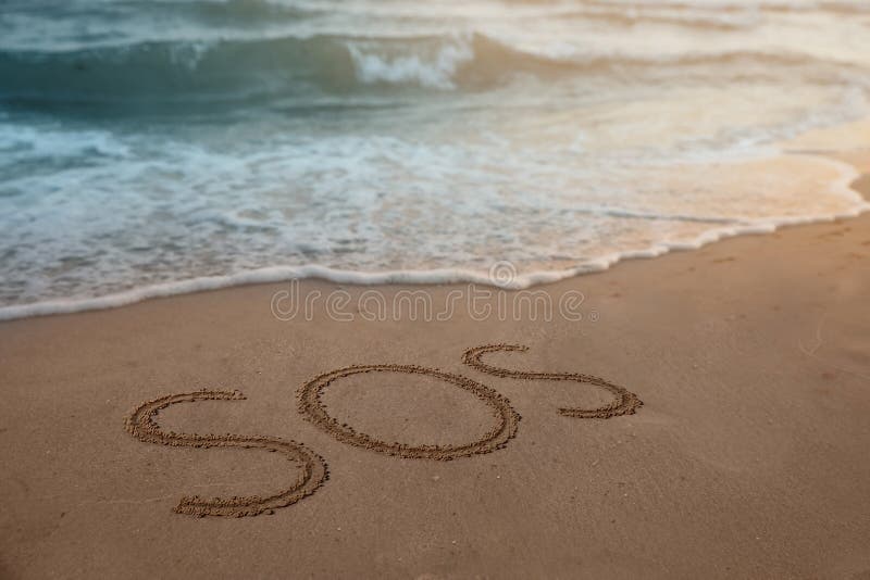 SOS Message Drawn on Sandy Beach Near Sea Stock Image - Image of drawn ...