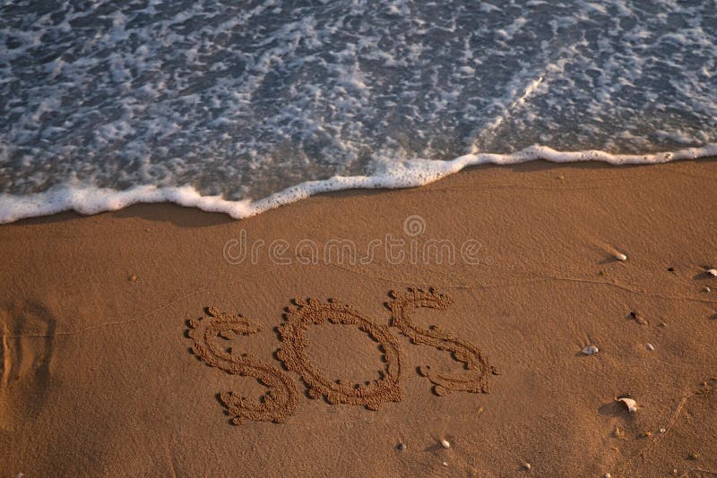 SOS Message Drawn on Sandy Beach Near Sea, Above View Stock Image ...