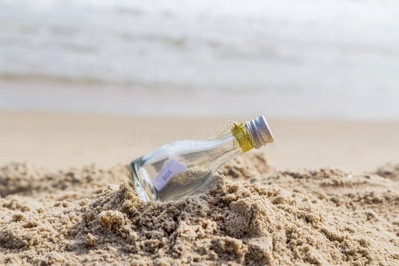 SOS Message in Glass Bottle Stock Photo - Image of outdoors, seaside ...