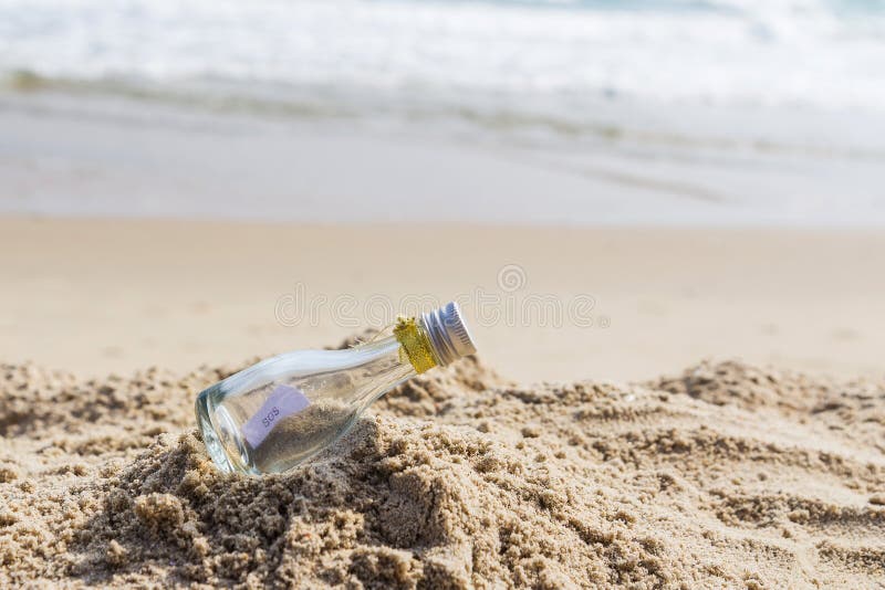SOS Message in Glass Bottle Stock Photo - Image of seaside, paper: 75758220