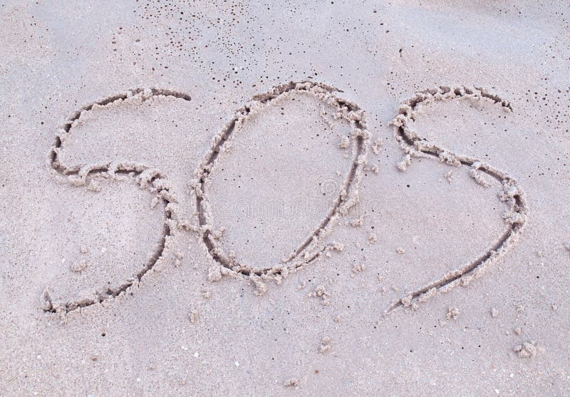 SOS writing on sand stock photo. Image of writing, sand - 698632
