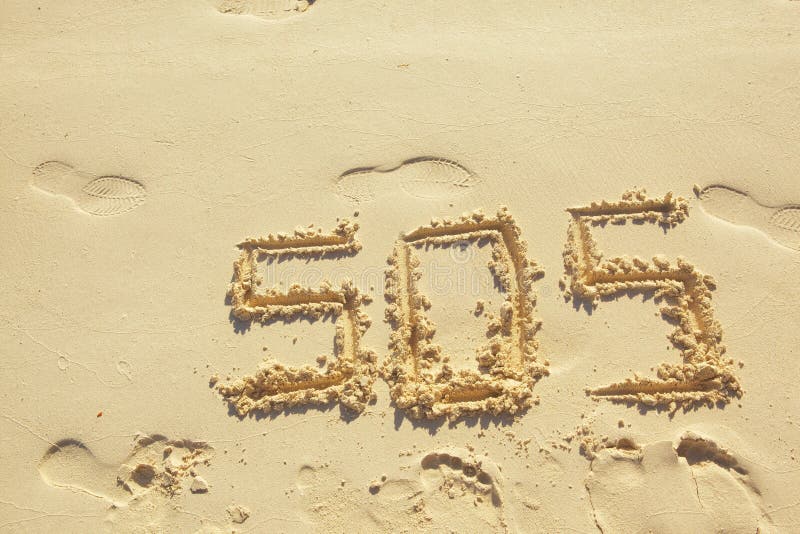 SOS writing on sand stock photo. Image of writing, sand - 698632