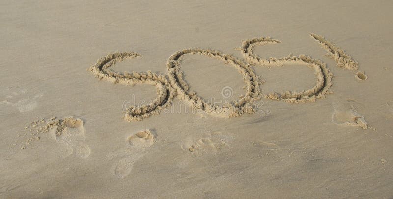 SOS sign in sand stock image. Image of ocean, sand, writing - 60115893