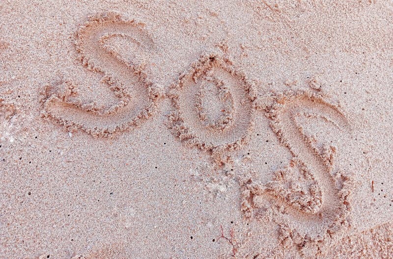 Sos Writing on Beach Sand with Detail and Texture Stock Photo - Image ...
