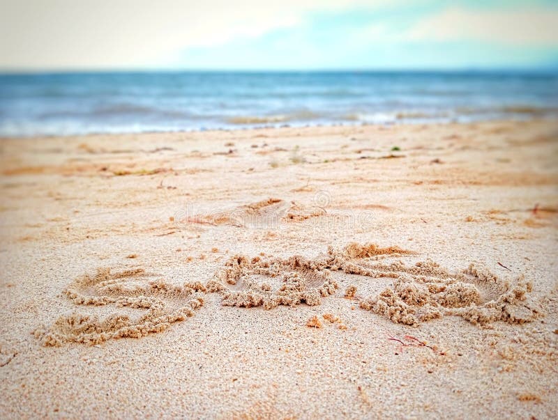 Sos Writing on Beach Sand with Detail and Texture Stock Image - Image ...