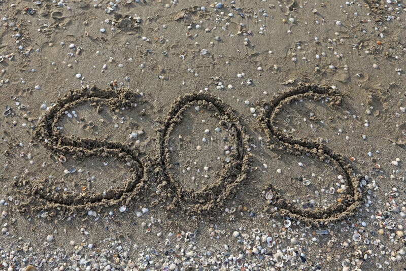SOS written in sand stock photo. Image of carved, help - 20136350