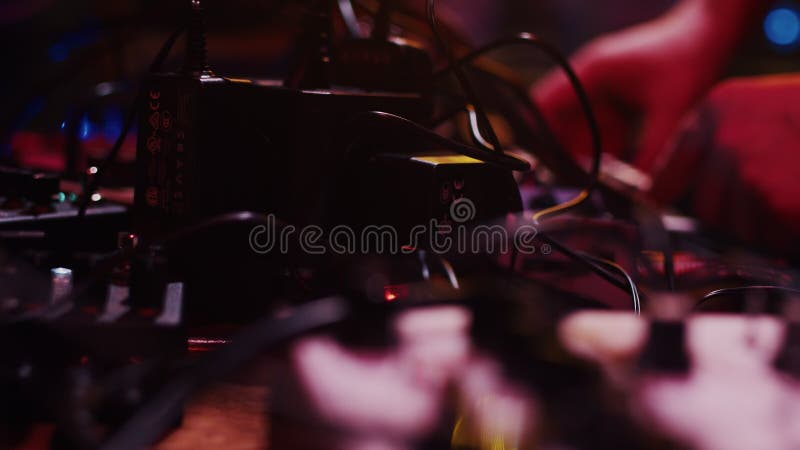 Sound Engineer Adjusting the Settings of a Controller Surrounded by ...