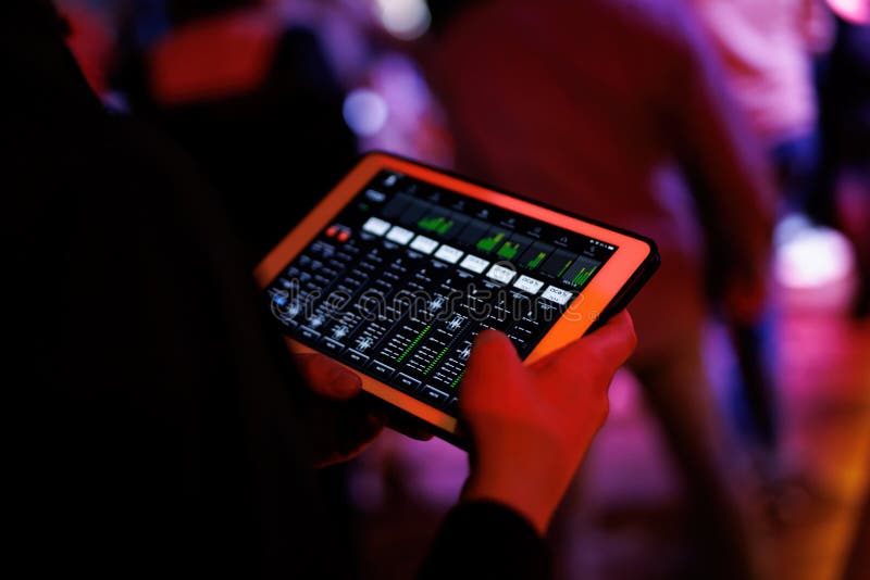 Sound Engineer Control the Concert Equipment Via Tablet. Stock Photo ...