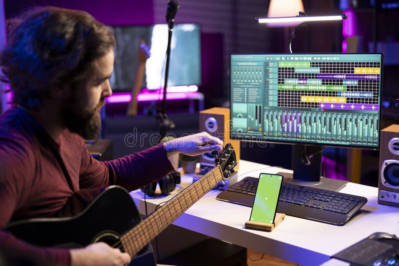Sound Engineer Learns Tuning Acoustic Guitar in Home Studio Stock Image ...