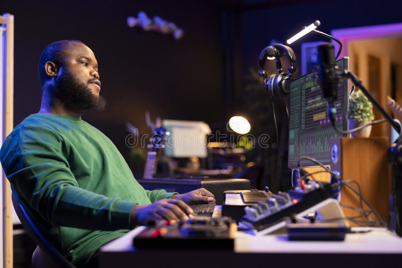 Sound Engineer Playing Piano and Mixing Tunes on Digital Software Stock ...