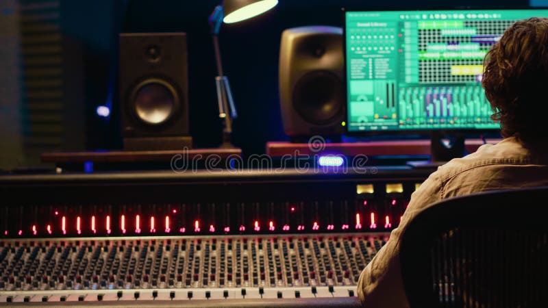 Sound Engineer Recording and Editing Tracks in Control Room Stock Video ...